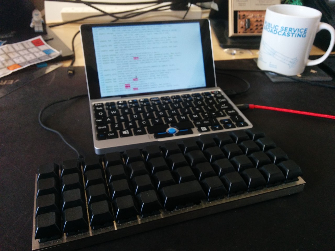 [tj] on repeat: "My tiny keyboard looks giant!" - Mastodon